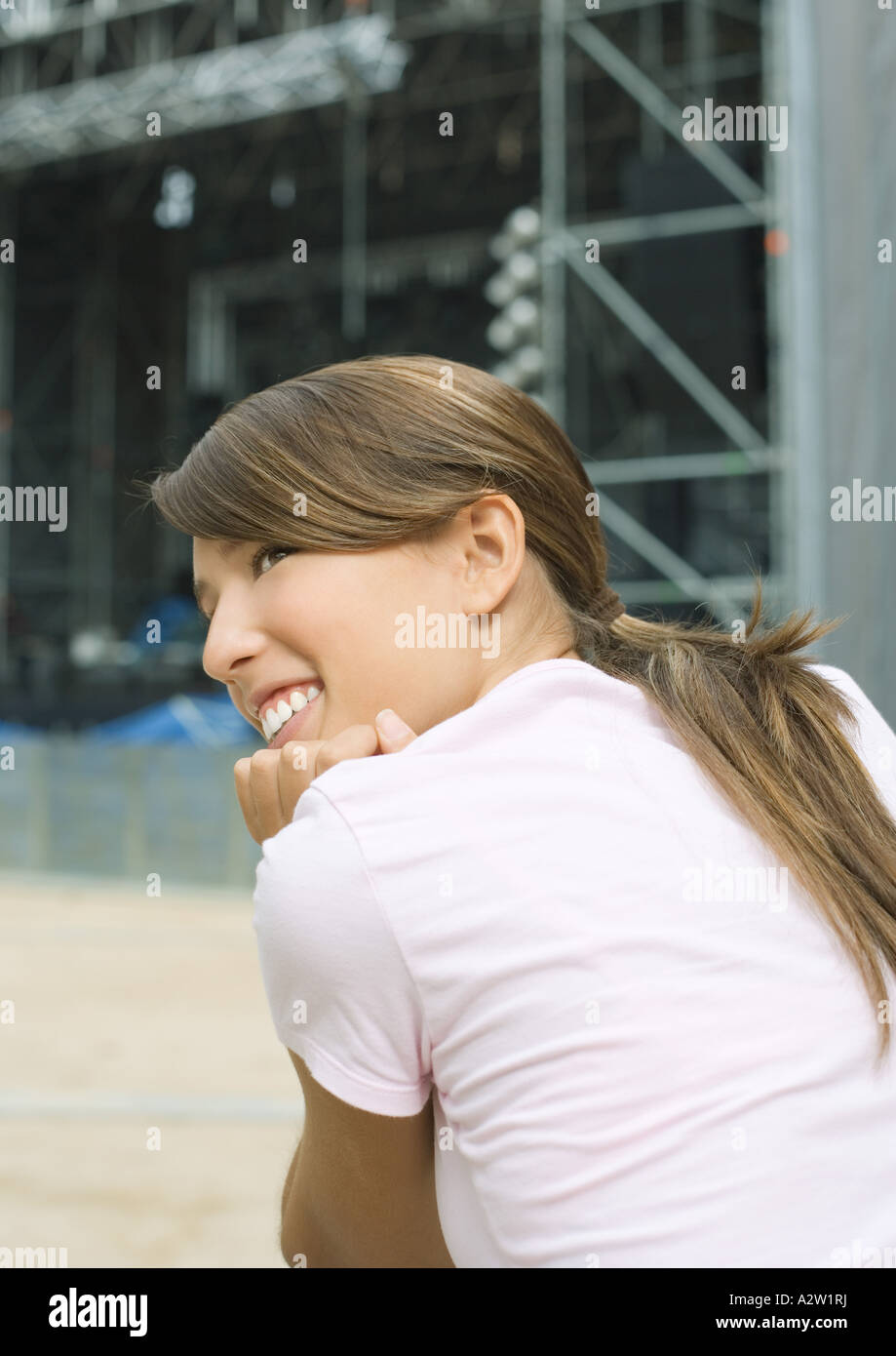 Teenage girl looking over shoulder Stock Photo - Alamy