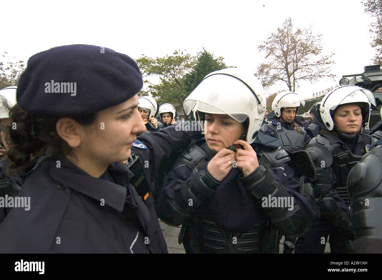 Turkish female anti-riot police officers putting their helmets during a ...