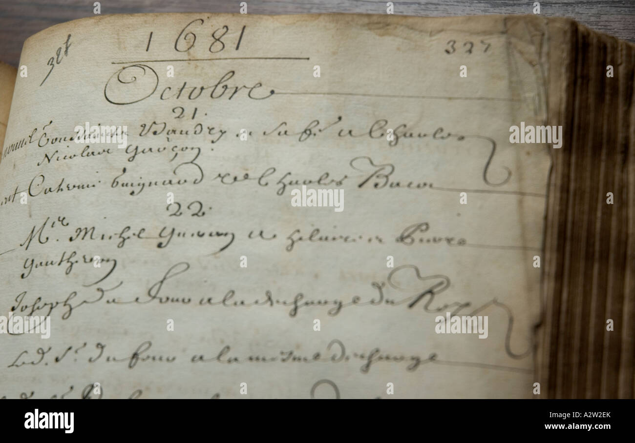Close-up of old French script in the volume of an ancient notary book ...