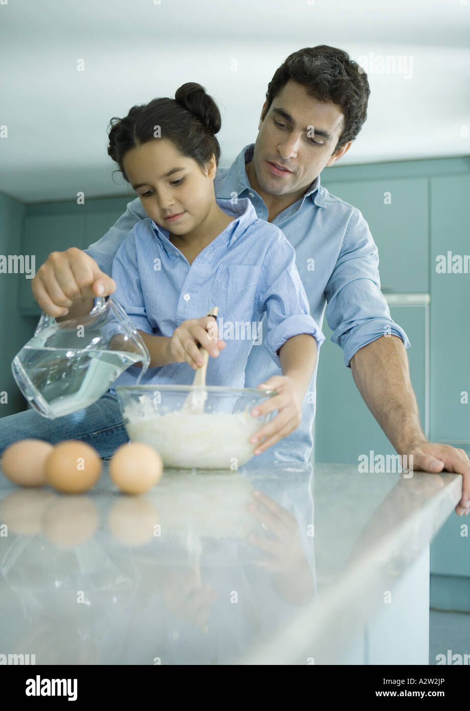 Father and daughter cooking together Stock Photo - Alamy