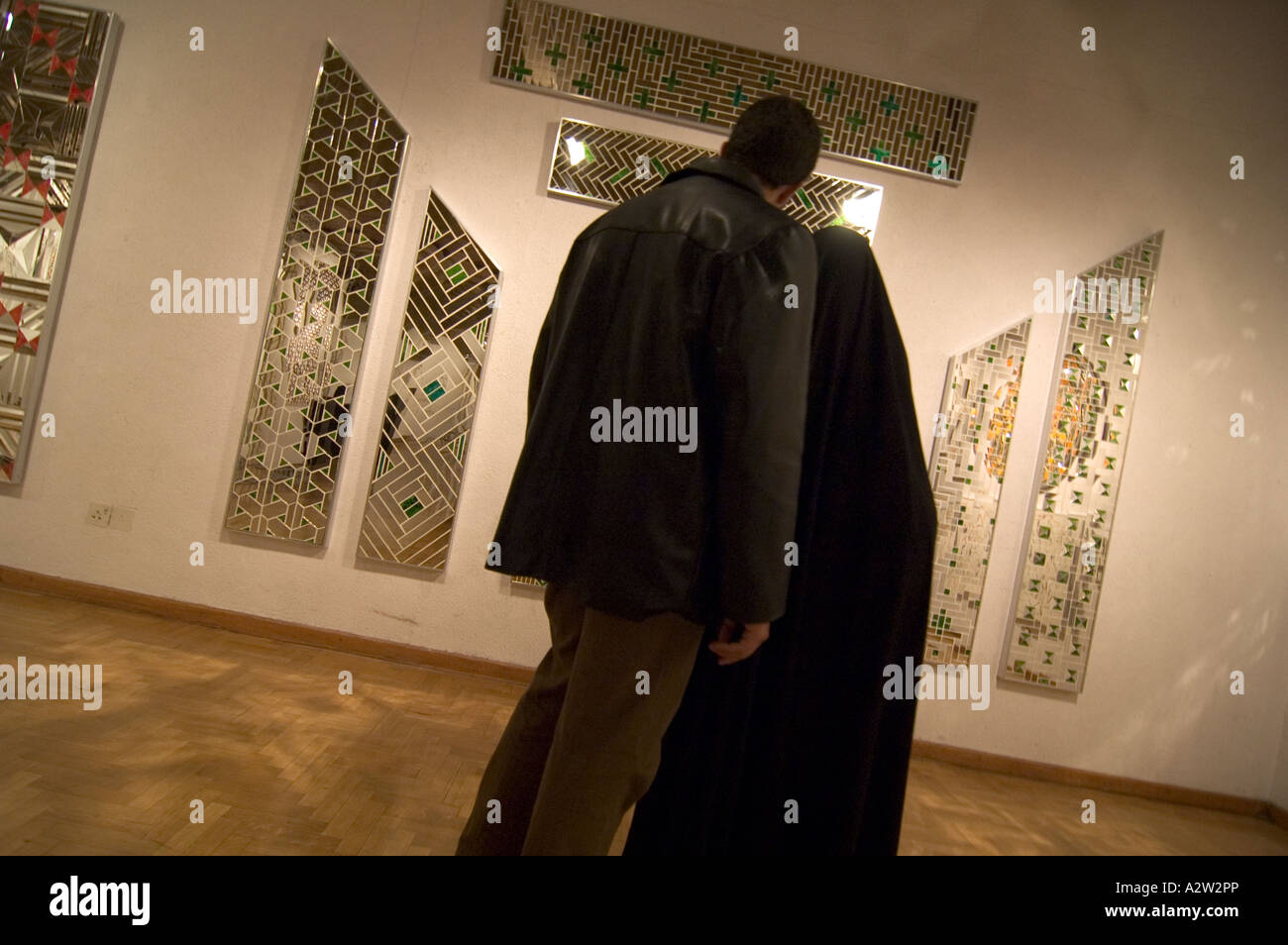 An Iranian couple visiting an art exhibition at a gallery in north ...