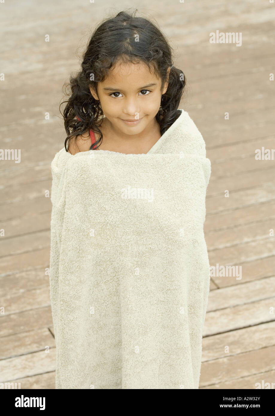 Girl wrapped in towel Stock Photo - Alamy