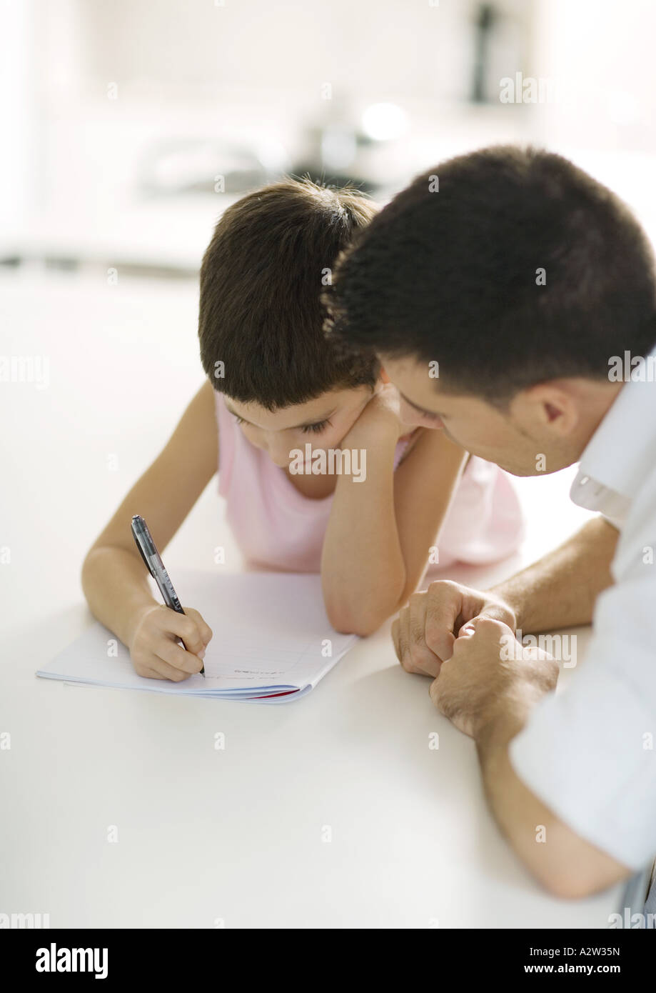 Father helping child with homework Stock Photo - Alamy