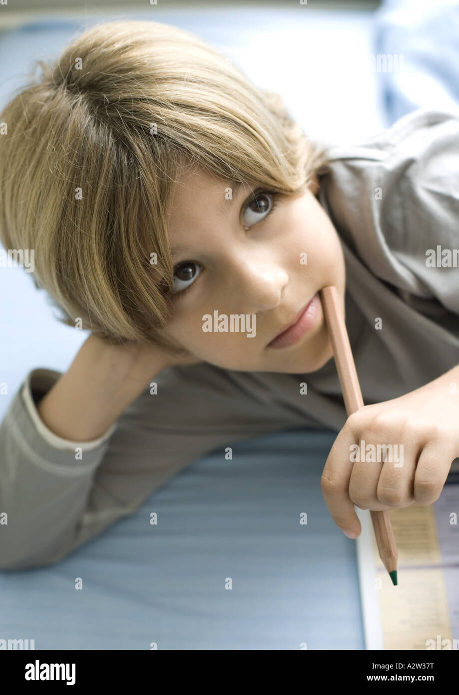 Child pencil in mouth hi-res stock photography and images - Alamy