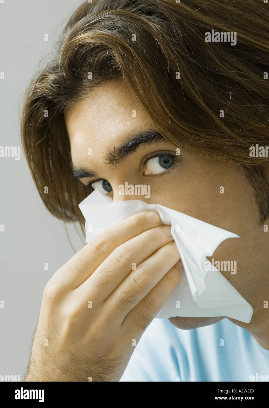 Man wiping nose Stock Photo - Alamy