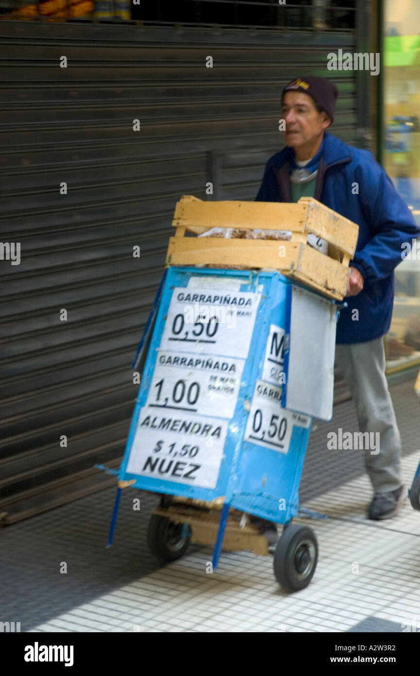 Man carrying products on a cart Stock Photo - Alamy