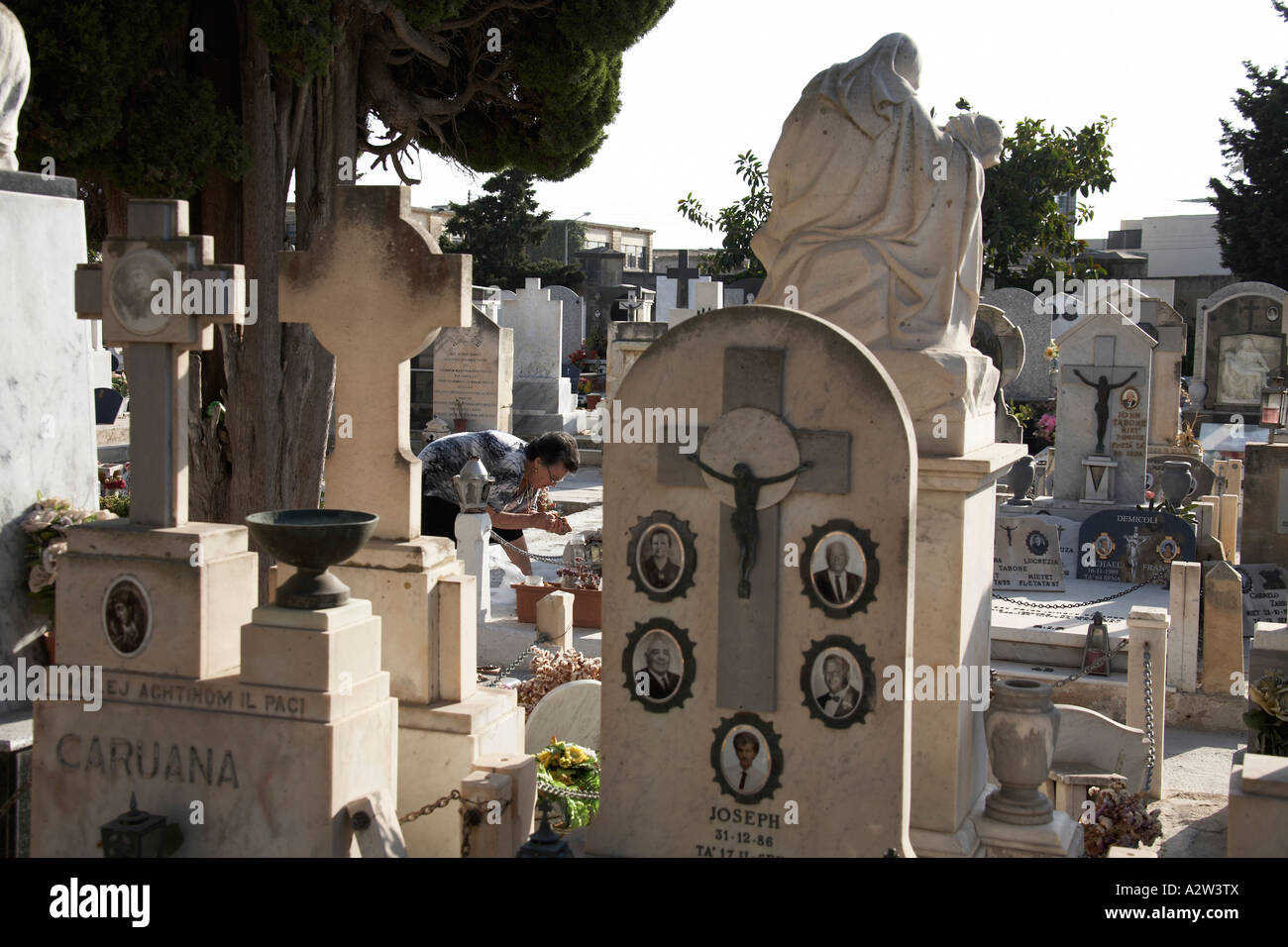 Graves and tombstones in Christian cemetery in Zejtun town on ...