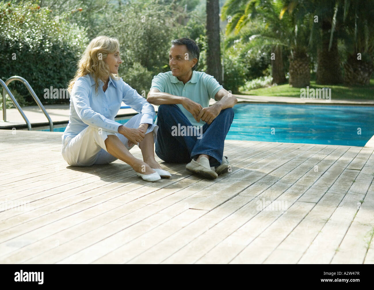 Two men sitting long pools hi-res stock photography and images - Alamy