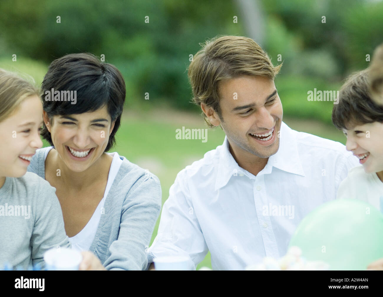 Family laughing, outdoors Stock Photo - Alamy