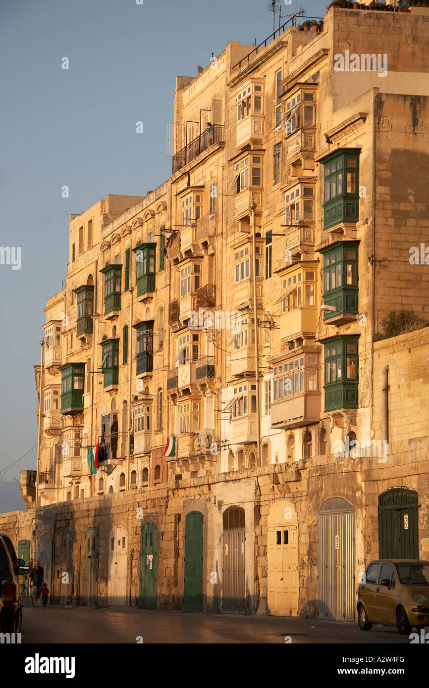 Traditional buildings balconies on Marsamxett street in evening ...