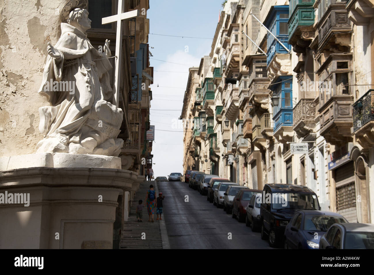 Religious christain figure with cross on Merchant Street corner in ...