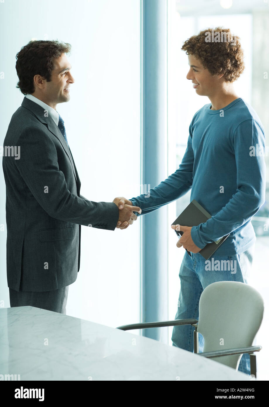 Teenagers Shaking Hands High Resolution Stock Photography and Images ...