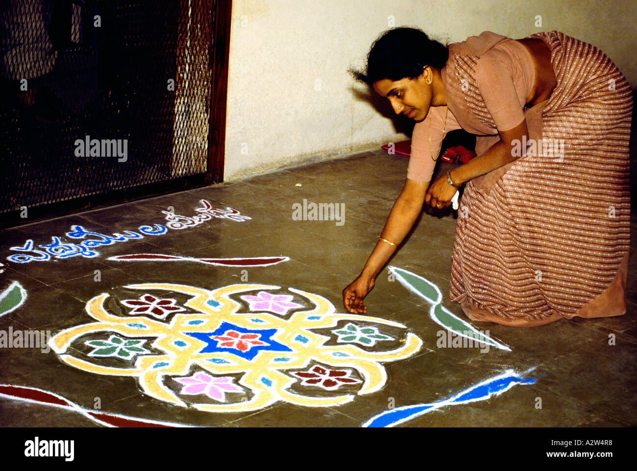 India woman rangoli pattern hi-res stock photography and images - Alamy
