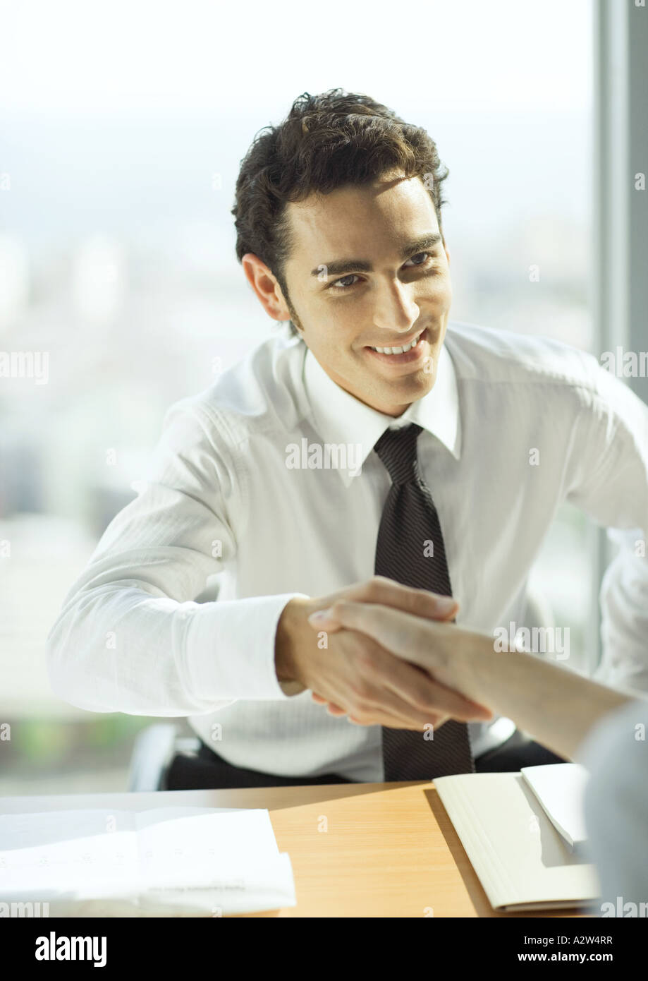 Two men sitting across the desk hi-res stock photography and images - Alamy