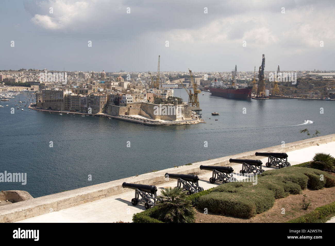 Cannons of Fort Lascaris in Valetta with Grand Harbour and Senglea ...