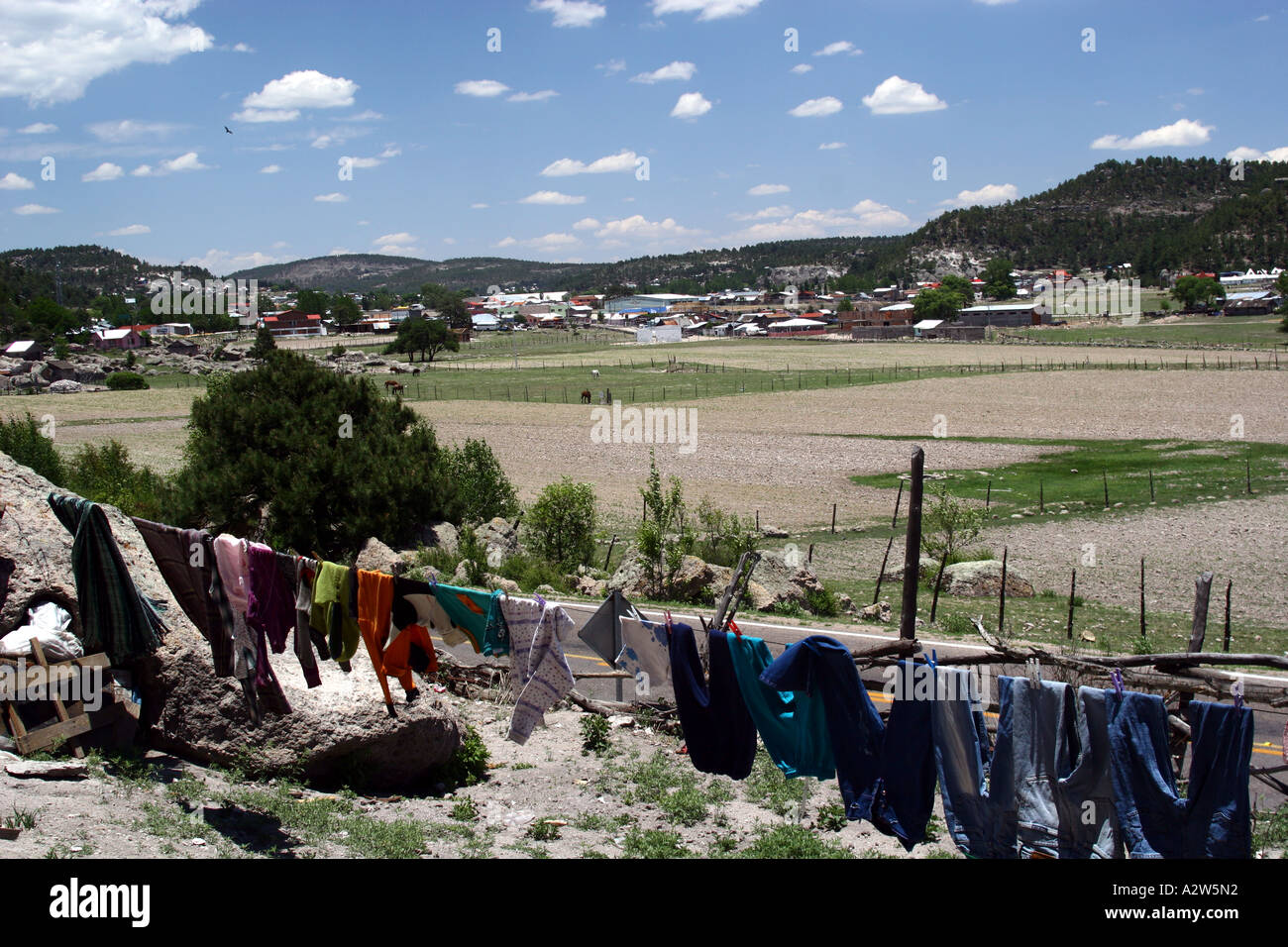 Washing on the line outside a cave which remains the home for a family ...