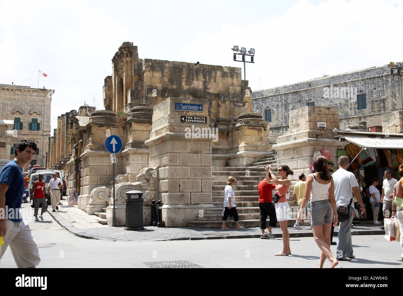 Tourists and people walking by ruins in Freedom Square in Valetta Malta ...