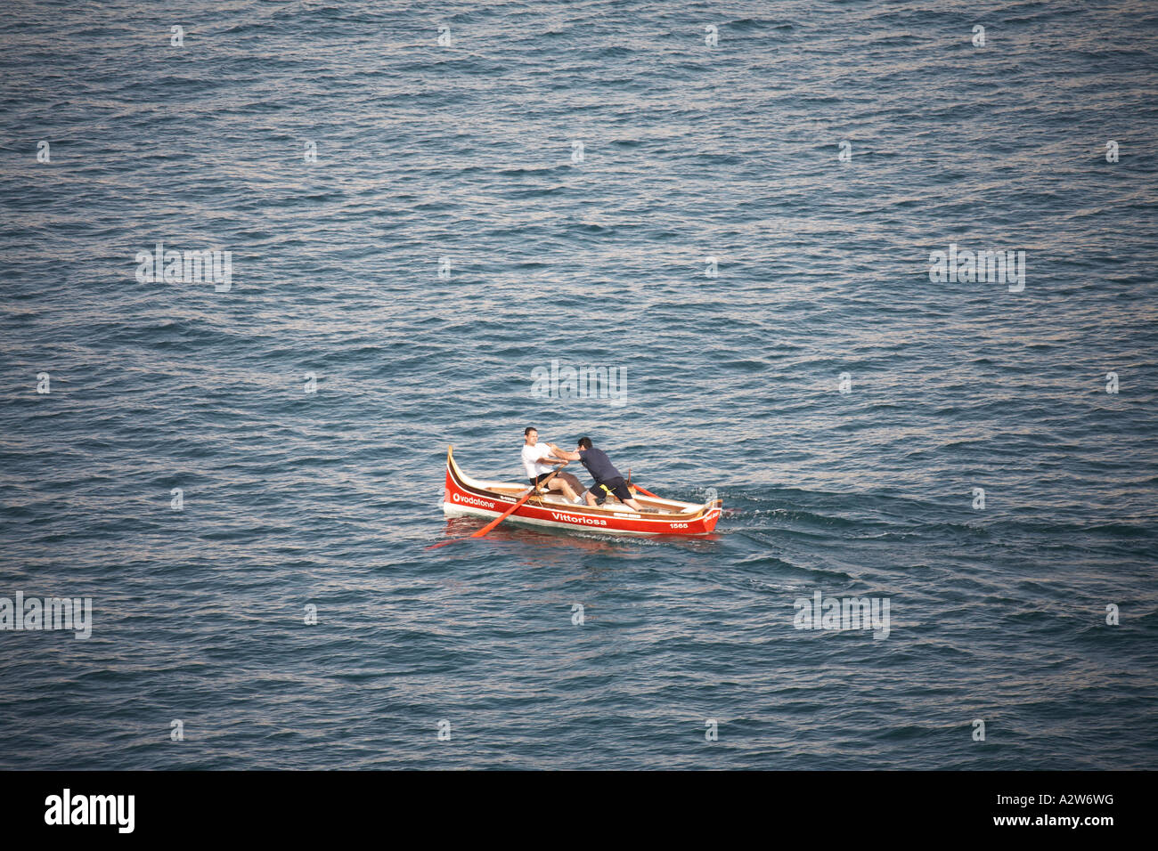 Two men rowing a small boat in Valetta Malta Stock Photo - Alamy