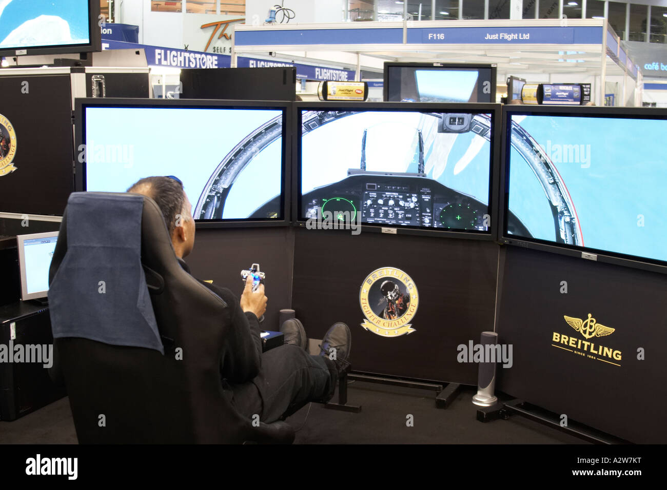 Pilot flying Breitling aircraft simulator at Aviation exhibition in ...