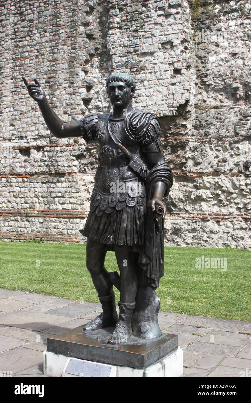Statue of Roman Emperor Trajan beside old London walls near Tower Hill ...