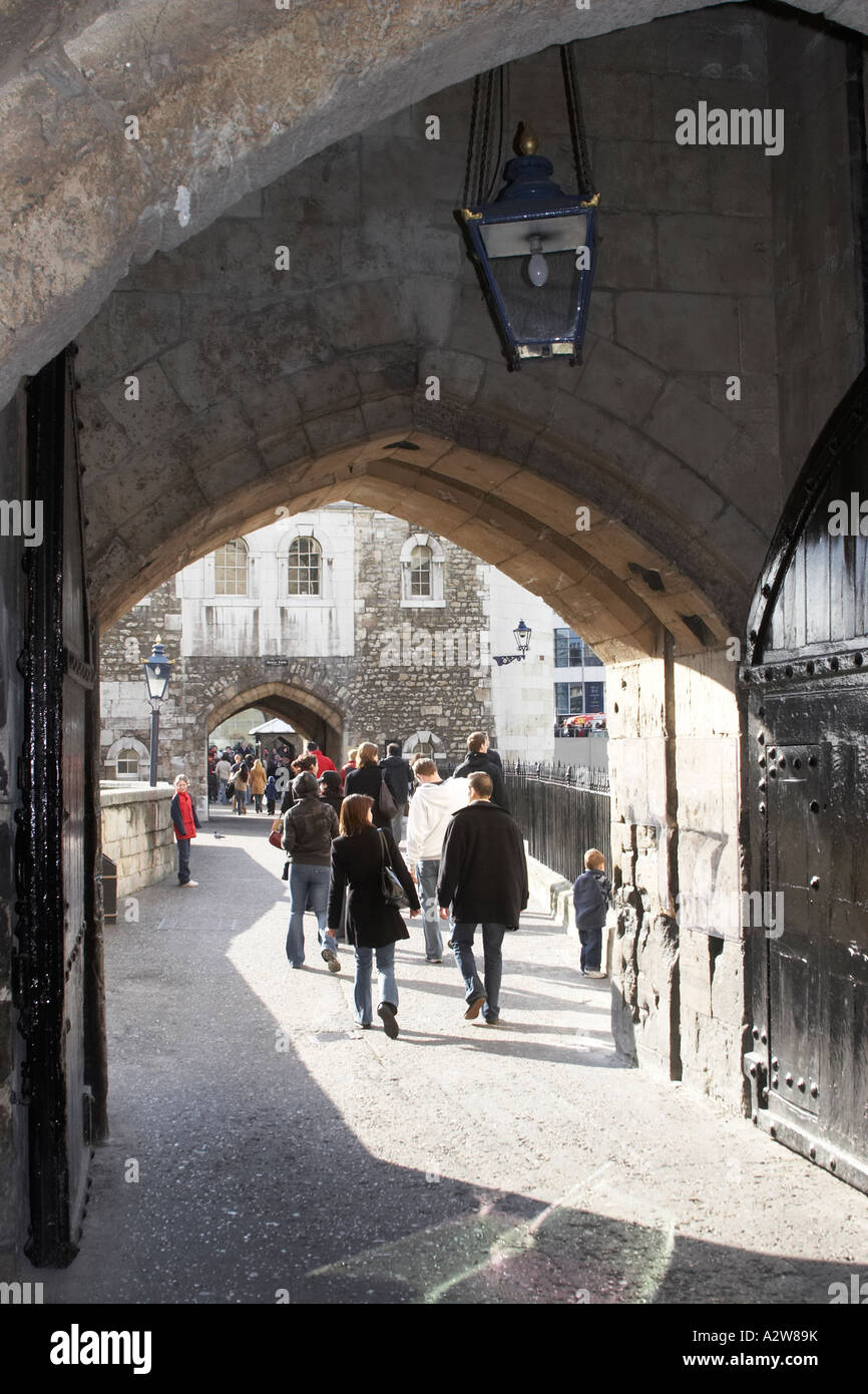 View thrugh Byward Tower with people visitors in Tower of London City ...