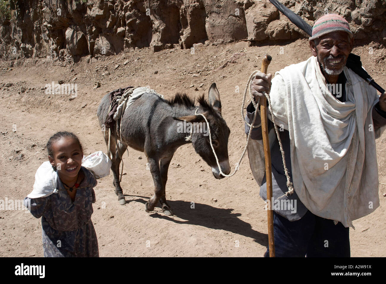 Man and girl with donkey coming back from the market in Lalibela ...