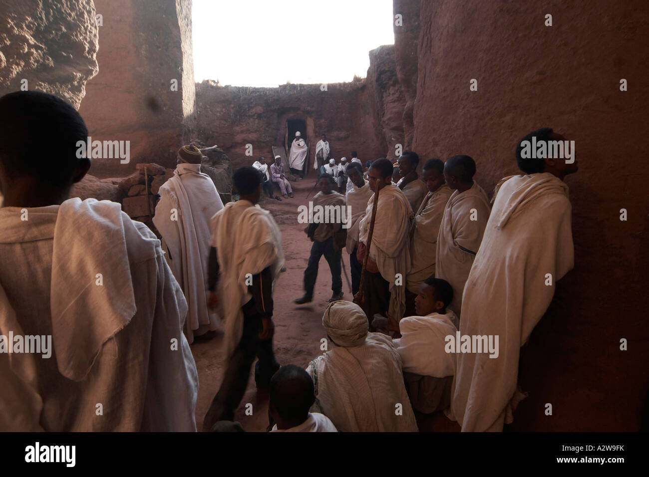 Priests and worshippers at dusk outside Bet Merkorios Orthodox ...