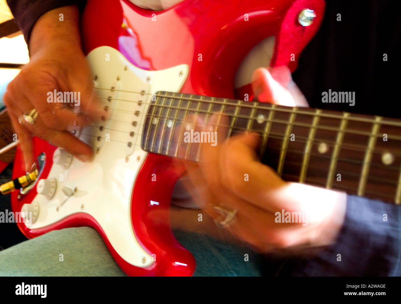 Guitarist playing a Fender Stratocaster electric guitar Stock Photo - Alamy