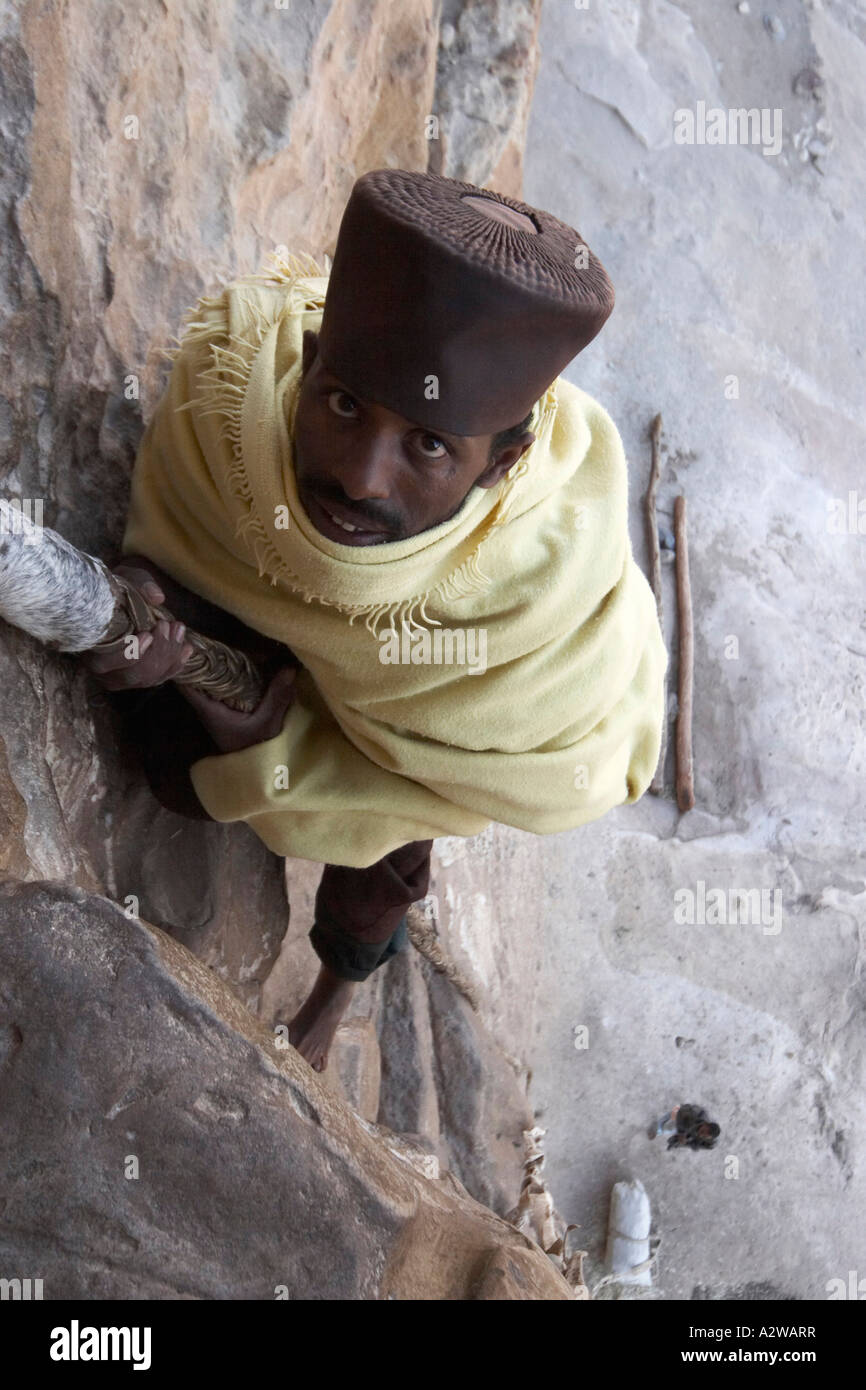 Monk or priest climbing ascending or descending rope to Debre Damo ...