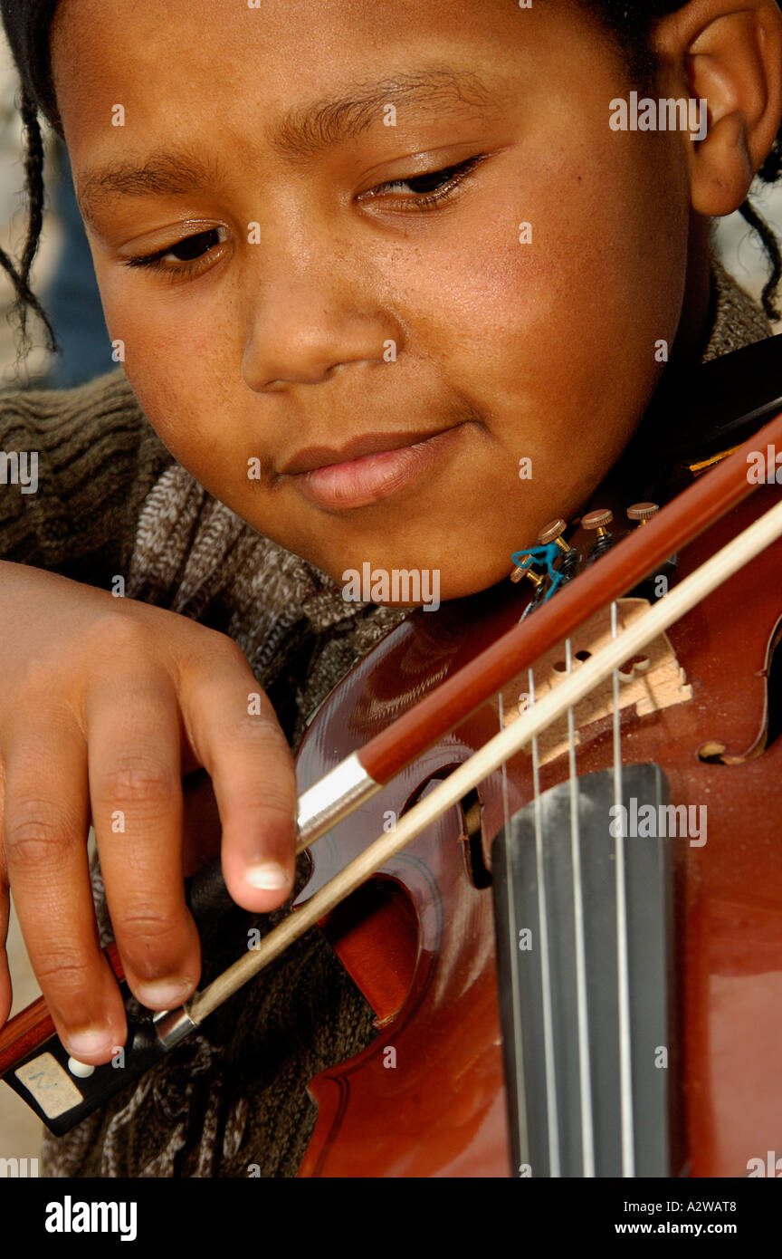 young African boy playing violin Stock Photo - Alamy