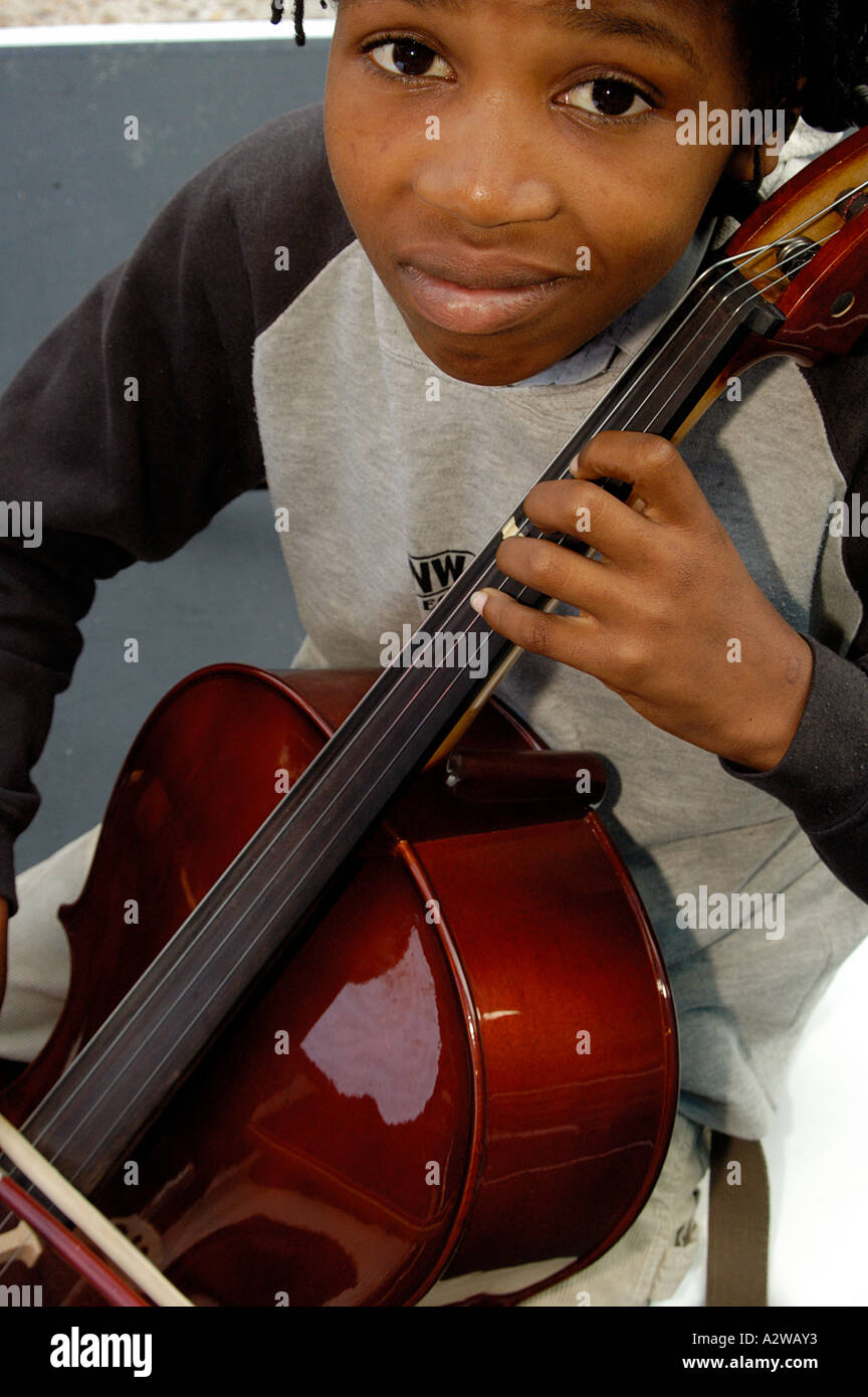young African boy playing viola Stock Photo - Alamy