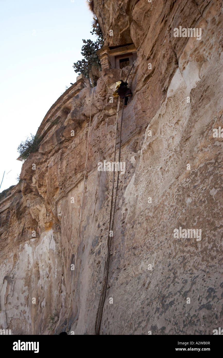 Monk or priest climbing ascending or descending rope to Debre Damo ...