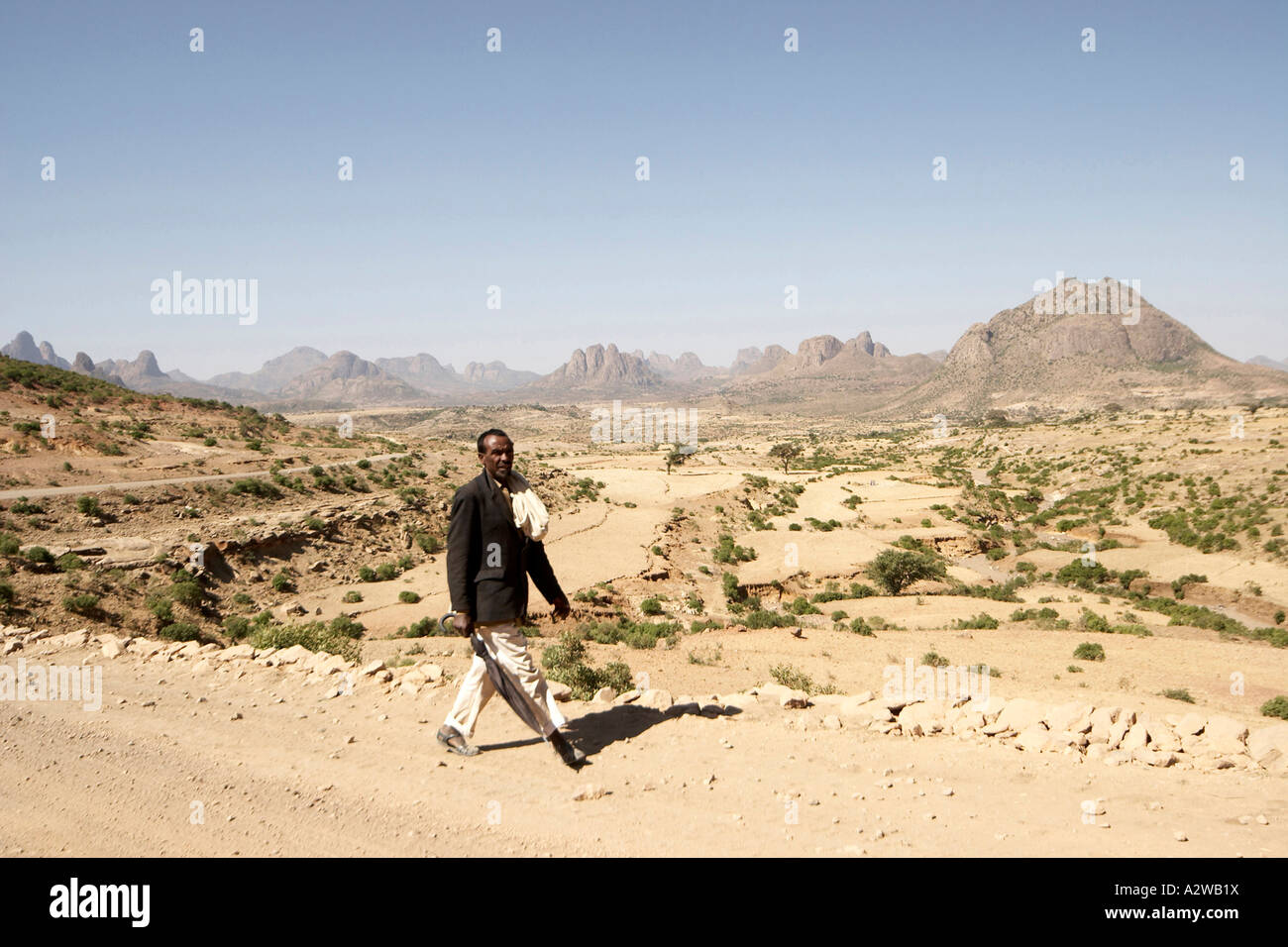 Mountain landscape of Ethiopia with distant Adwa mountains and man ...