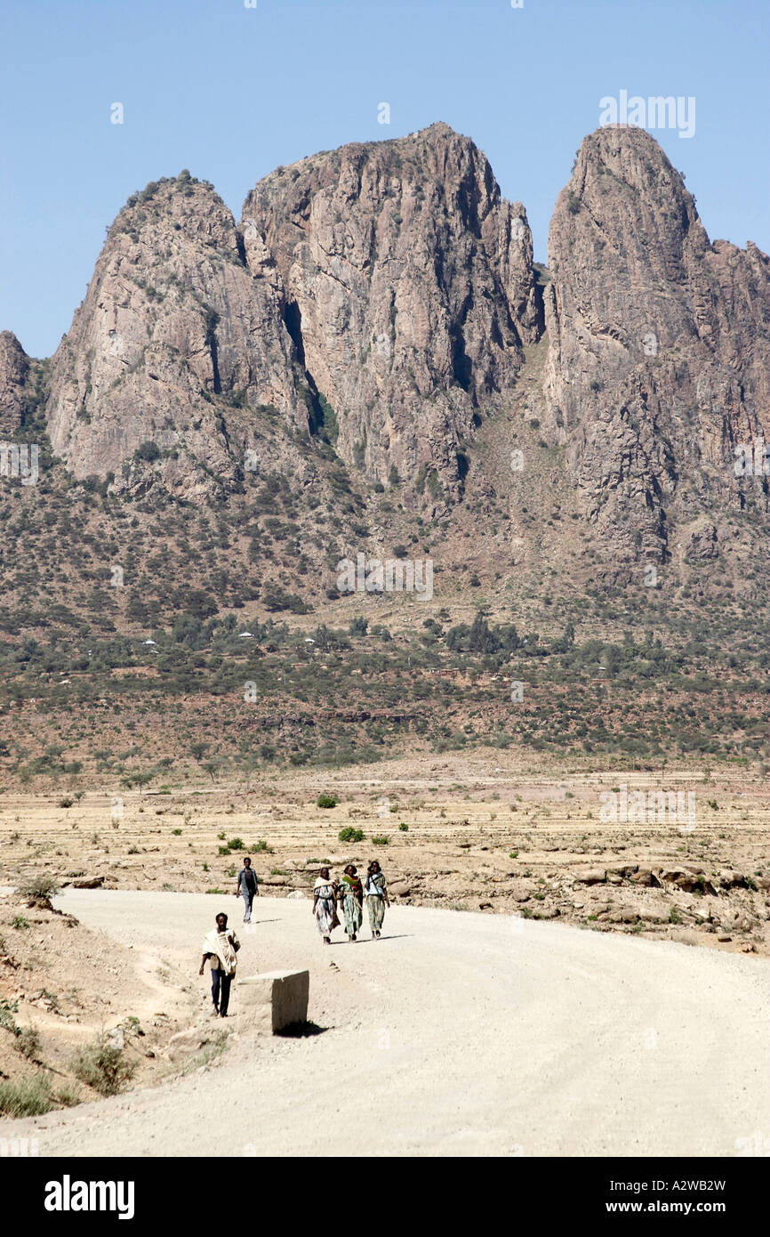 People walking on dirt road with Adwa mountains in distance northern ...