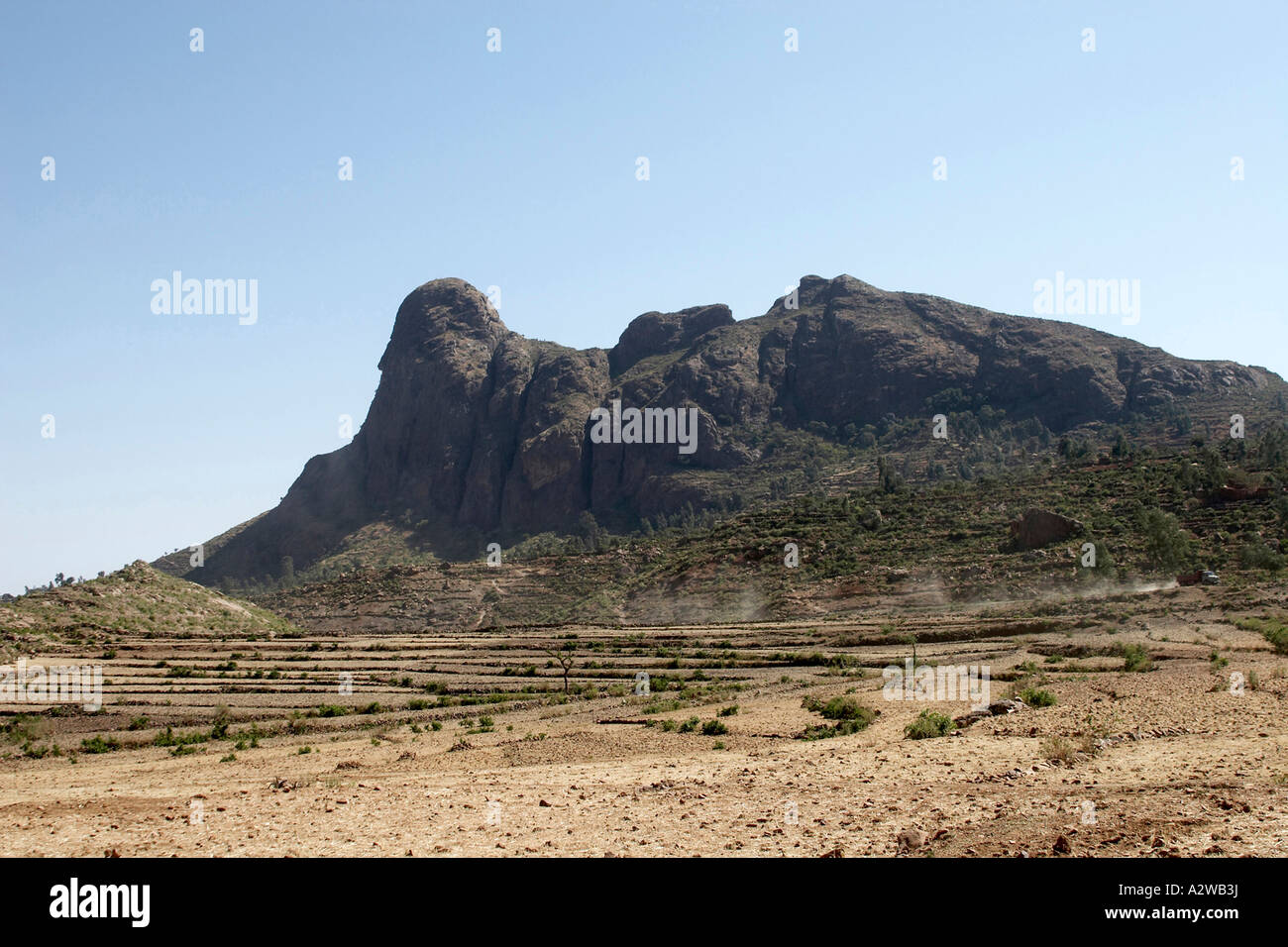 Adwa mountains in shape of Sphinx in distance beyond cultivated fields ...