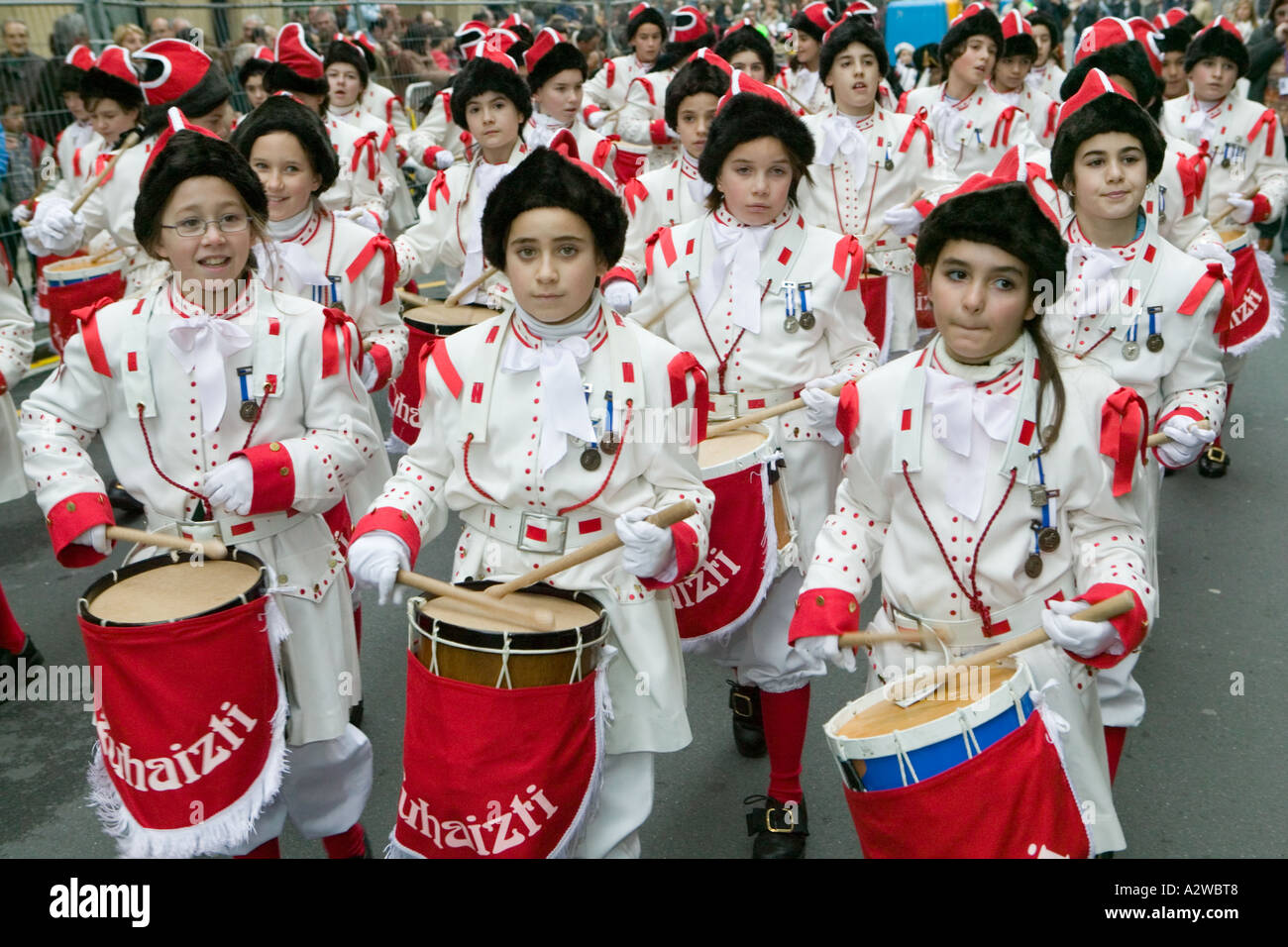 Young Basque girls wearing period costume parade during La Tamborrada ...