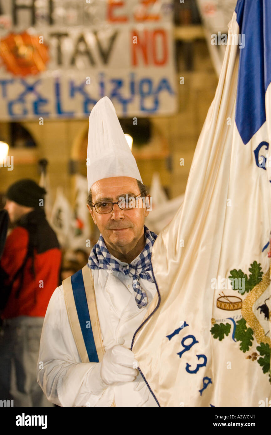Basque man wearing white chefs outfits at night during La Tamborrada ...