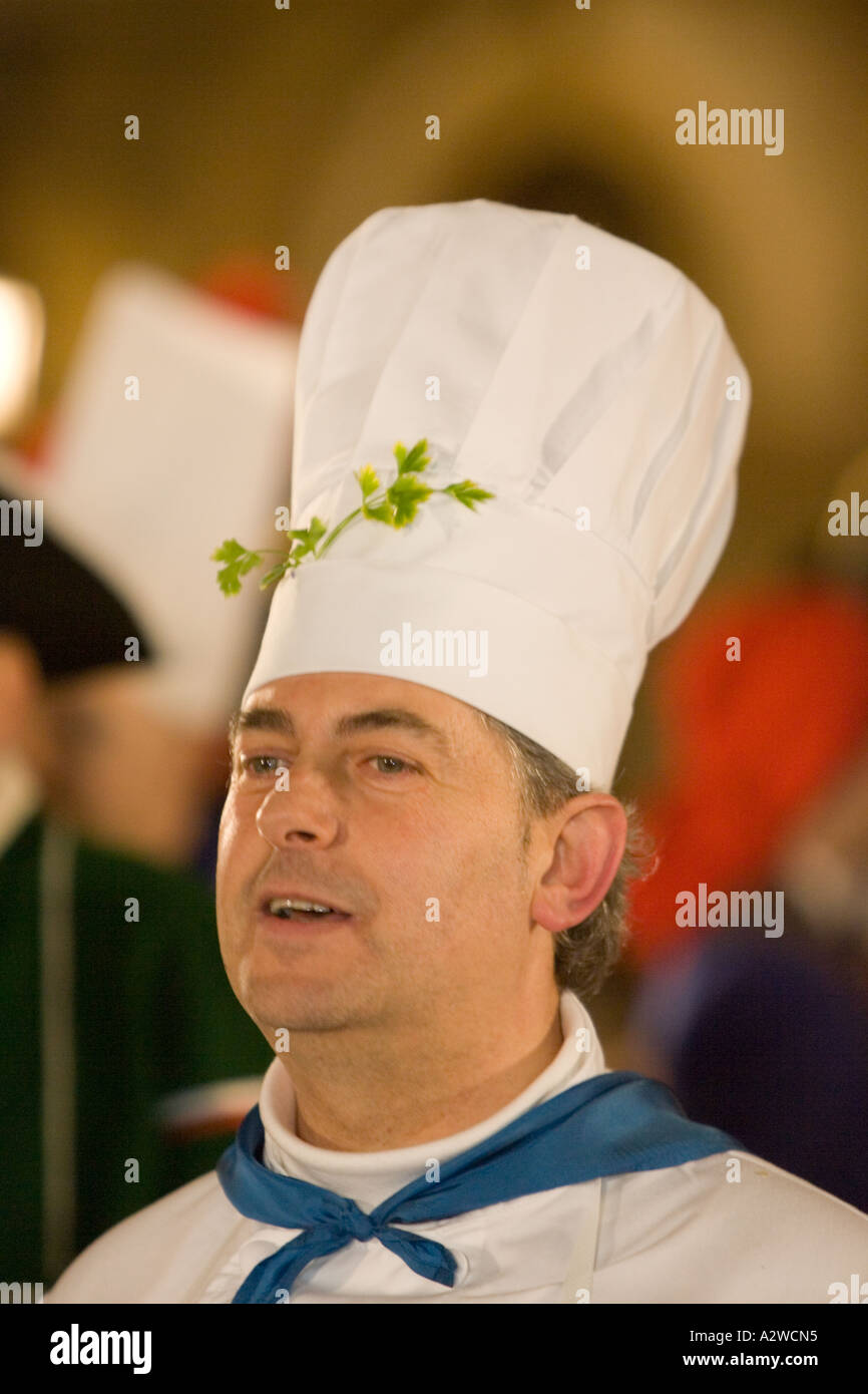 Basque man wearing white chefs outfits at night during La Tamborrada ...