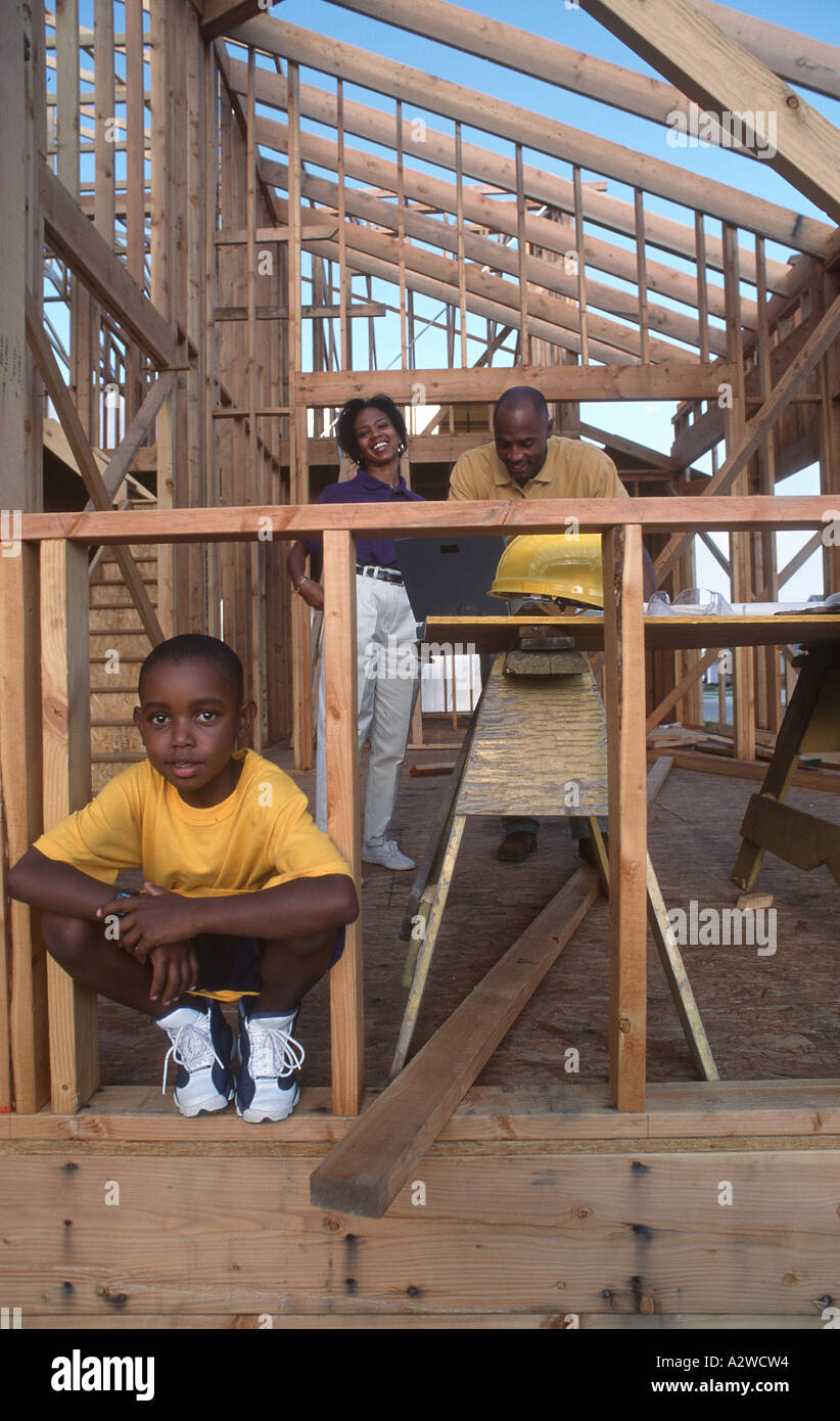 Family and construction worker during house construction Stock Photo ...