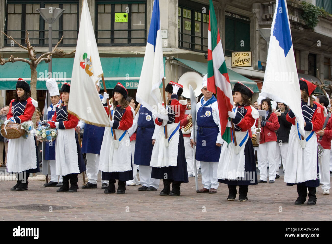 Young Basque women holding flags, La Tamborrada, Donostia San Sebastian ...