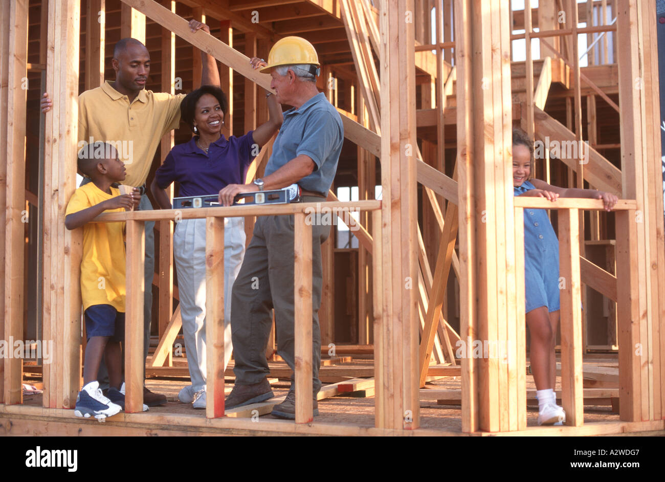 Family and builder during home construction Stock Photo - Alamy