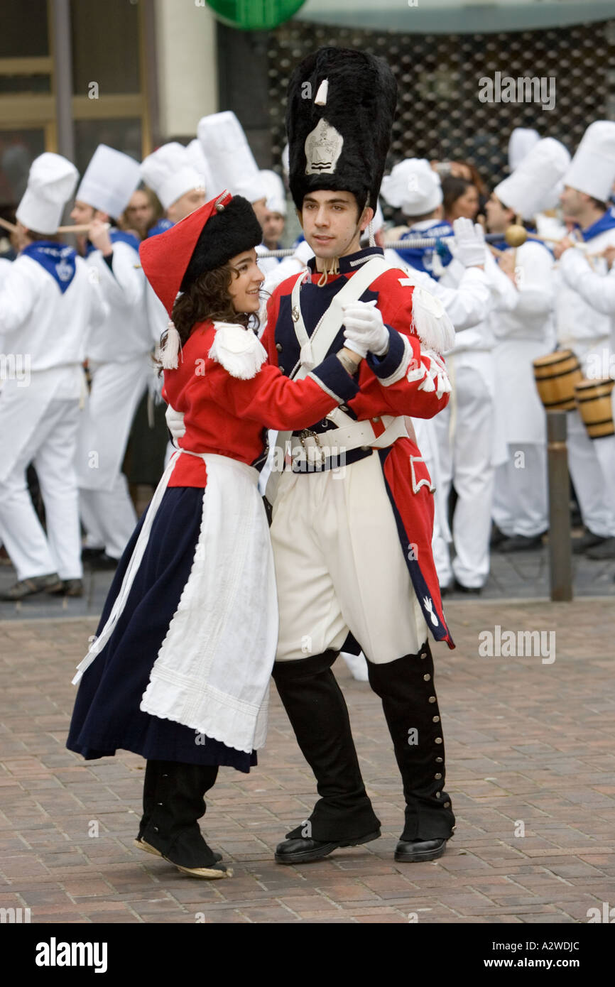 A Basque couple wearing traditional military uniforms dancing, La ...