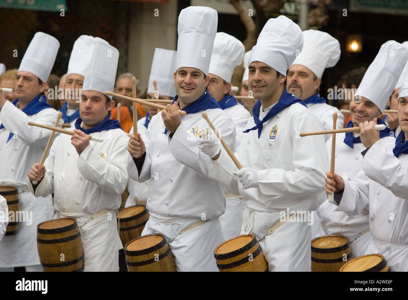 Men in white chefs outfits drumming on barrels, La Tamborrada, Donostia ...