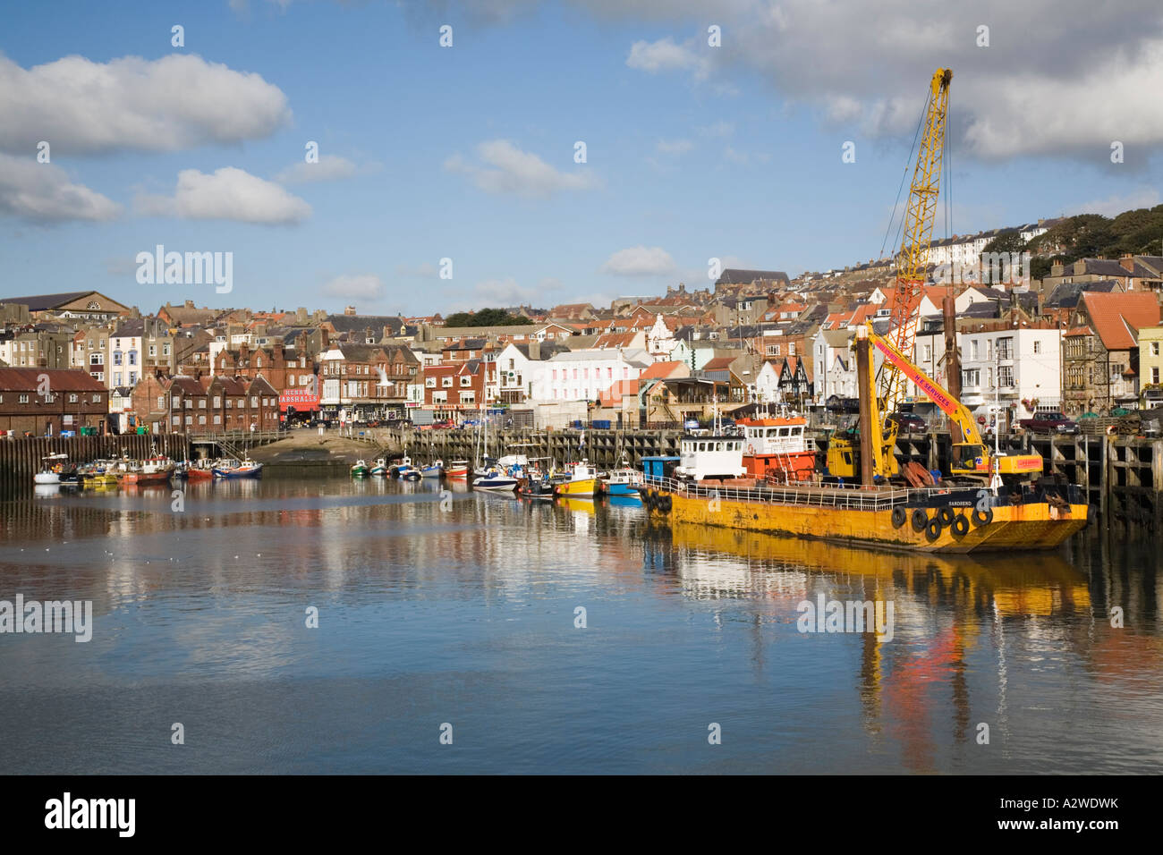 Old Harbour moored boats with town seafront buildings on Sandside ...