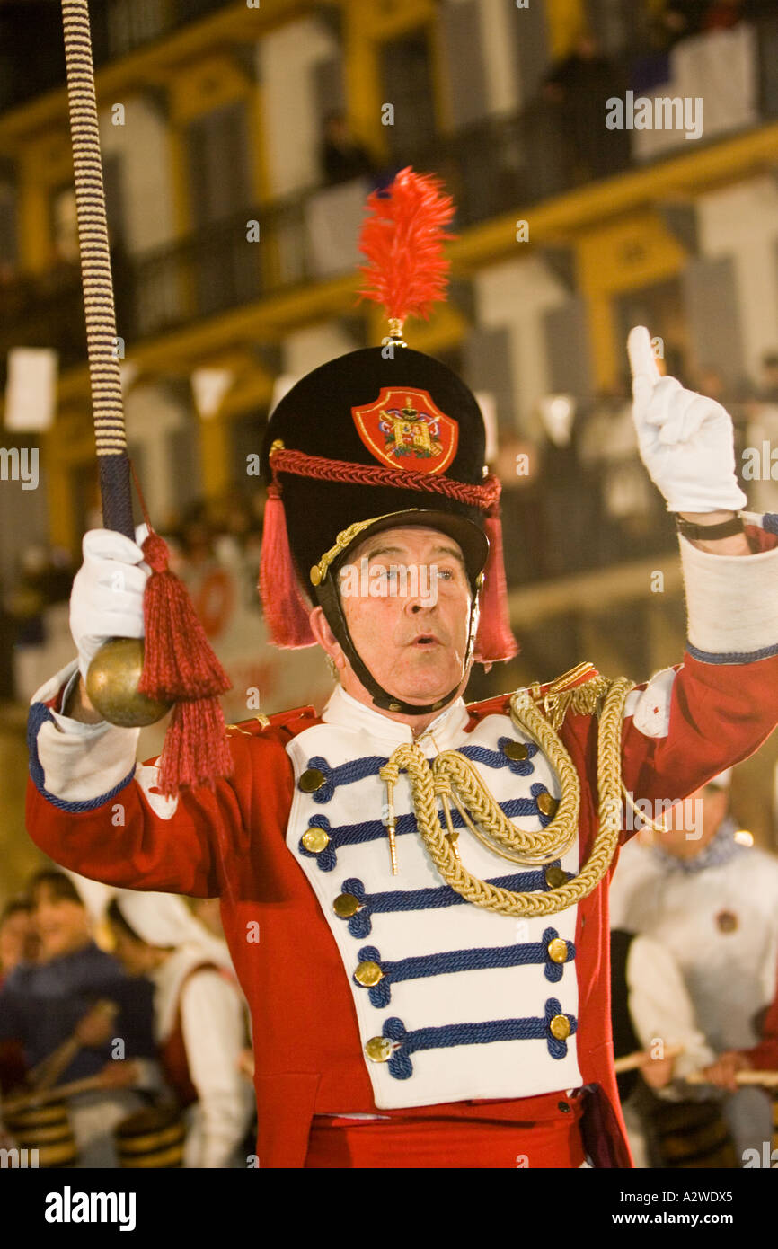 Basque band leader in period costume conducting during La Tamborrada ...