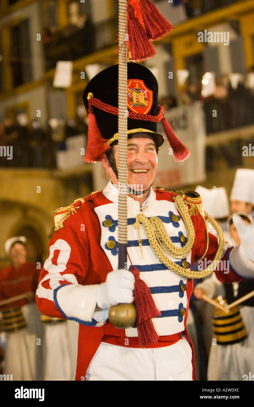 Basque band leader in period costume conducting during La Tamborrada ...