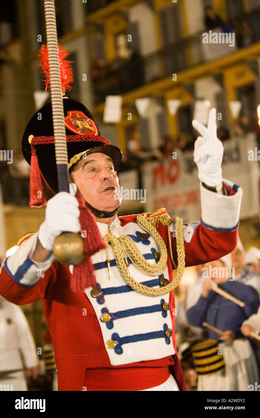 Basque band leader in period costume conducting during La Tamborrada ...