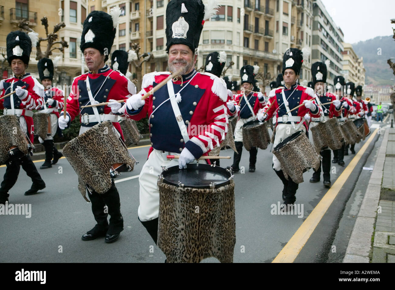 Basque men wearing colourful traditional military uniforms enjoy La ...