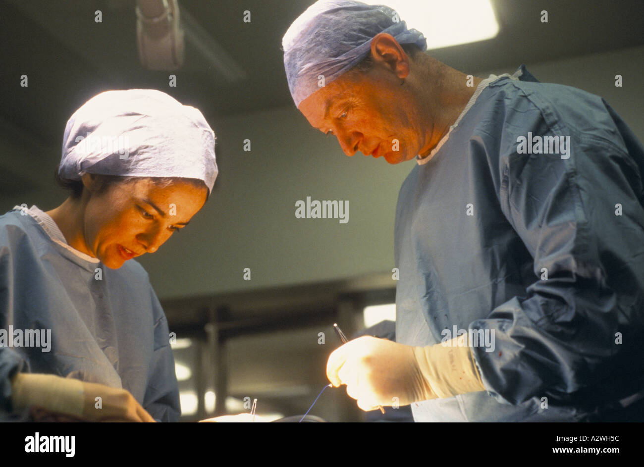 sewing up after operation Harley street surgery Stock Photo - Alamy
