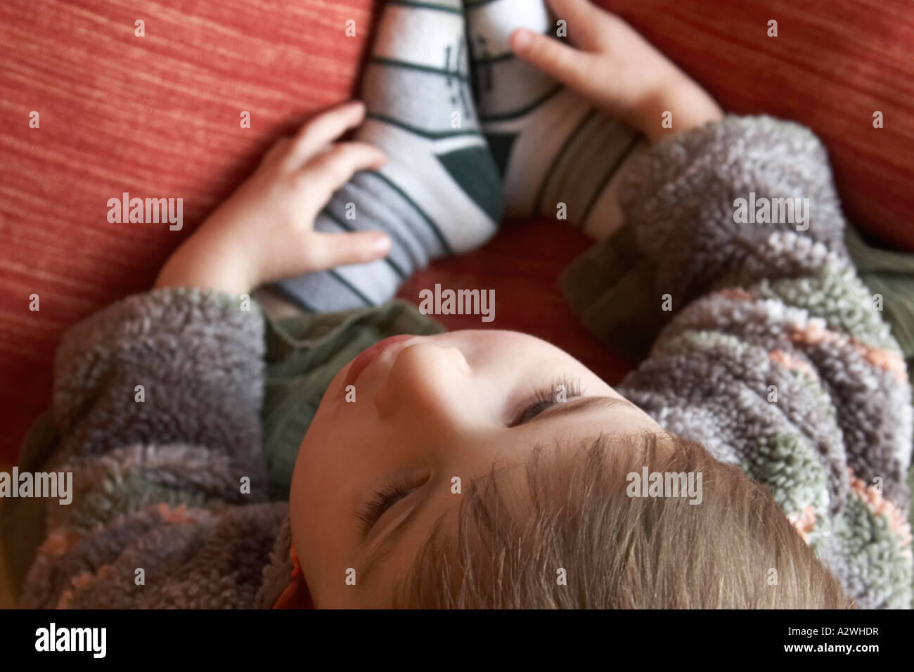 Young boy child from above sitting watching television CJWH Stock Photo ...